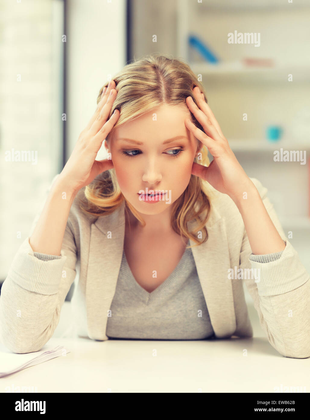 bored and tired woman behind the table Stock Photo - Alamy