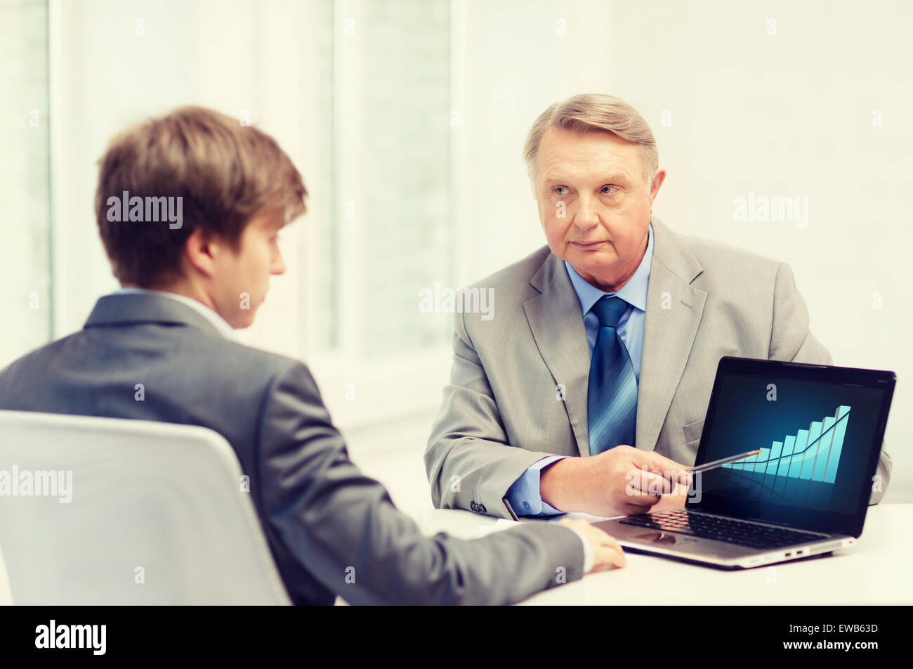 older man and young man with laptop computer Stock Photo - Alamy