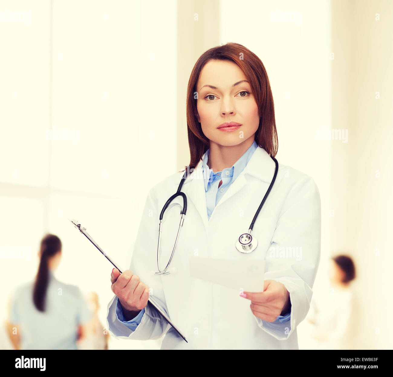 calm female doctor with clipboard Stock Photo - Alamy