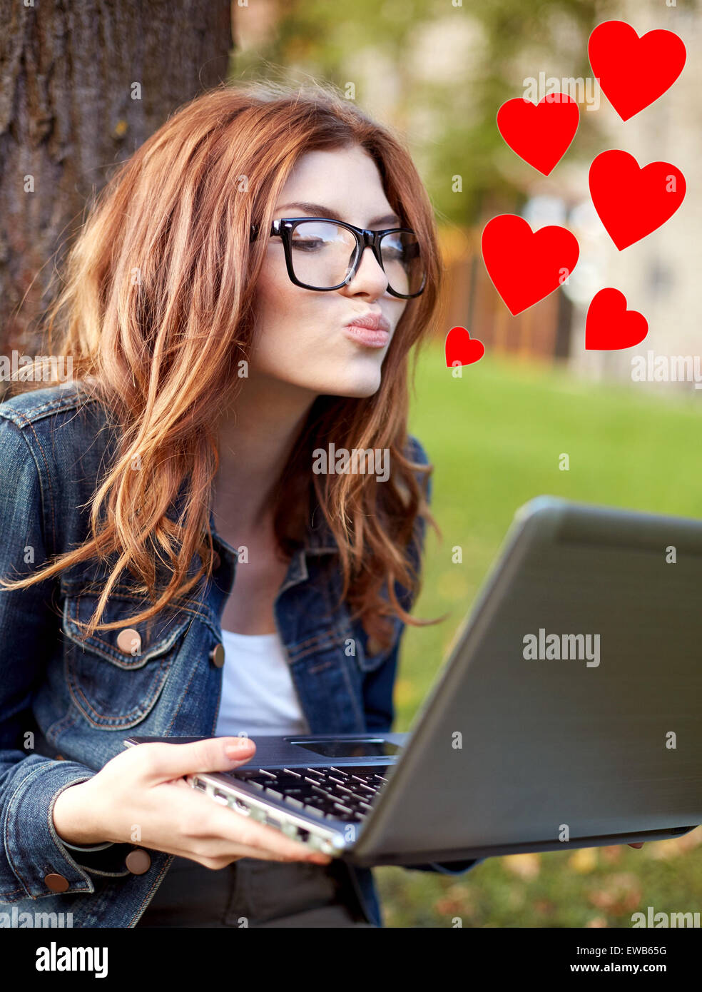 happy student girl writing to notebook at campus Stock Photo - Alamy