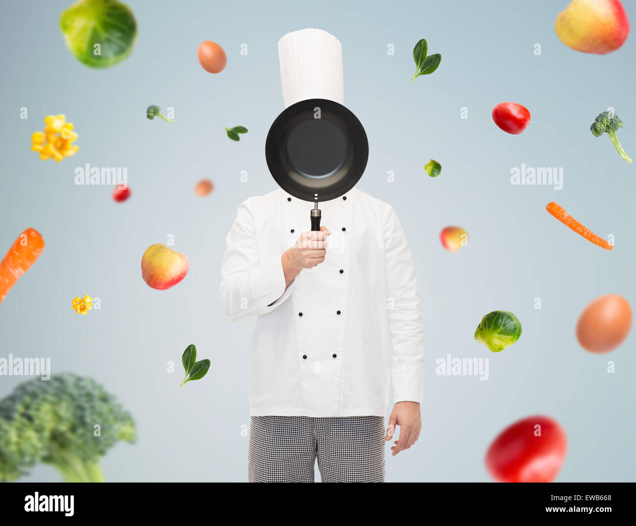 male chef cook covering face with frying pan Stock Photo - Alamy