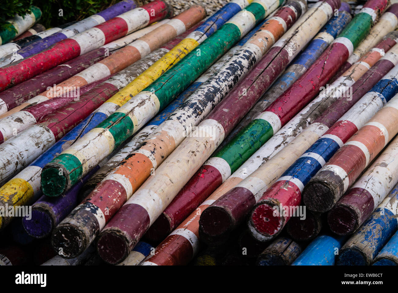 Stack of colourful, striped poles viewed from the left end Stock Photo ...