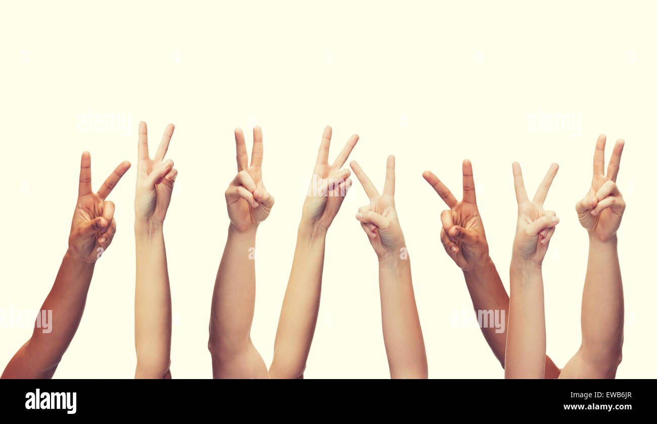 human hands showing v-sign Stock Photo - Alamy