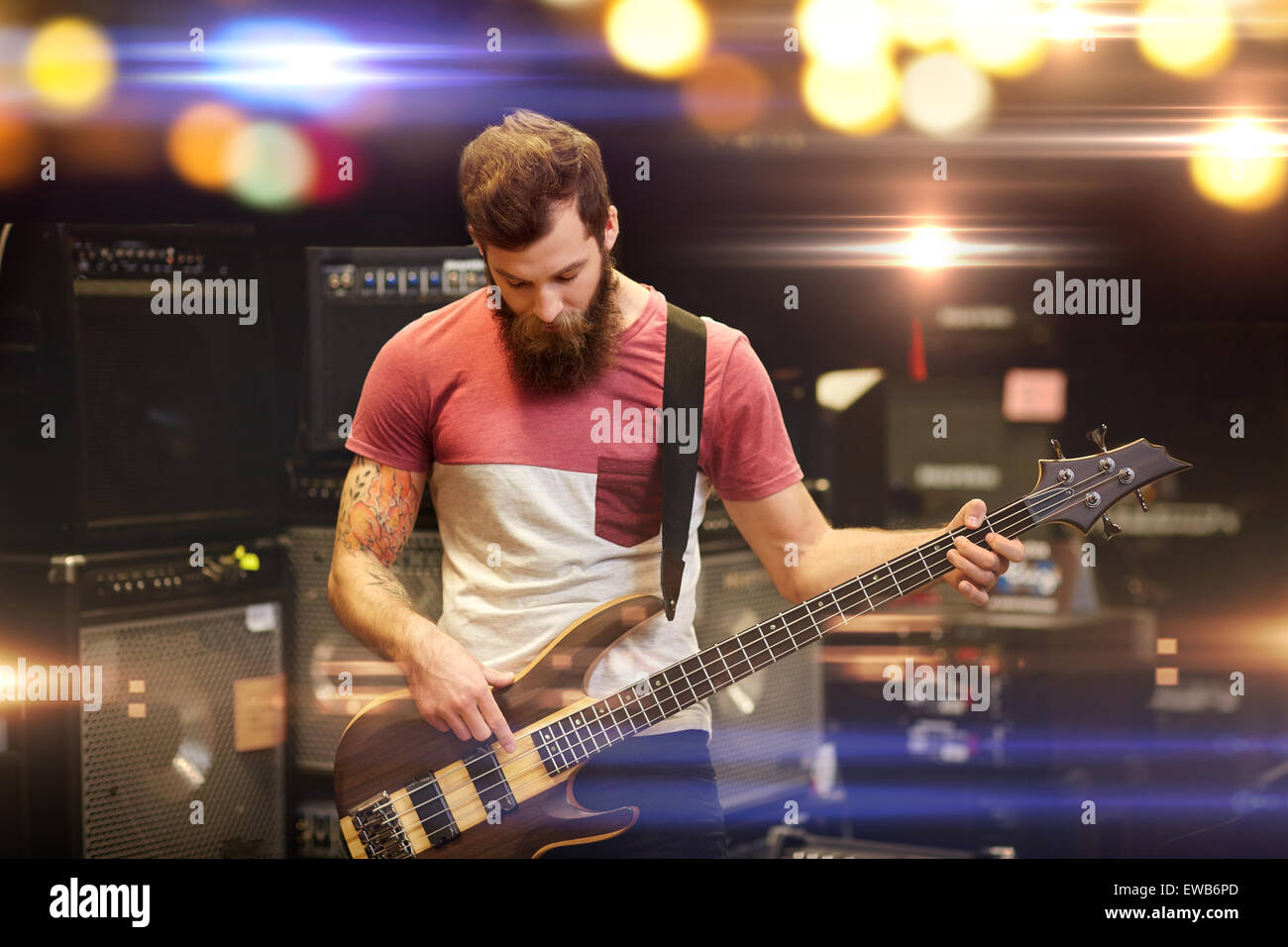 musician or customer with guitar at music store Stock Photo - Alamy