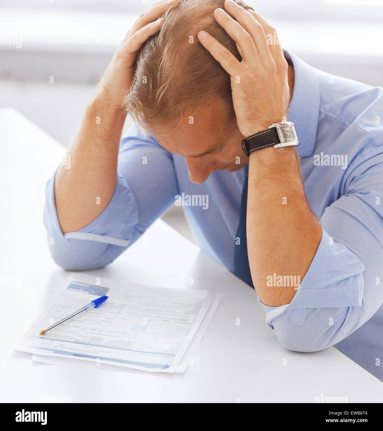stressed businessman with papers at work Stock Photo - Alamy