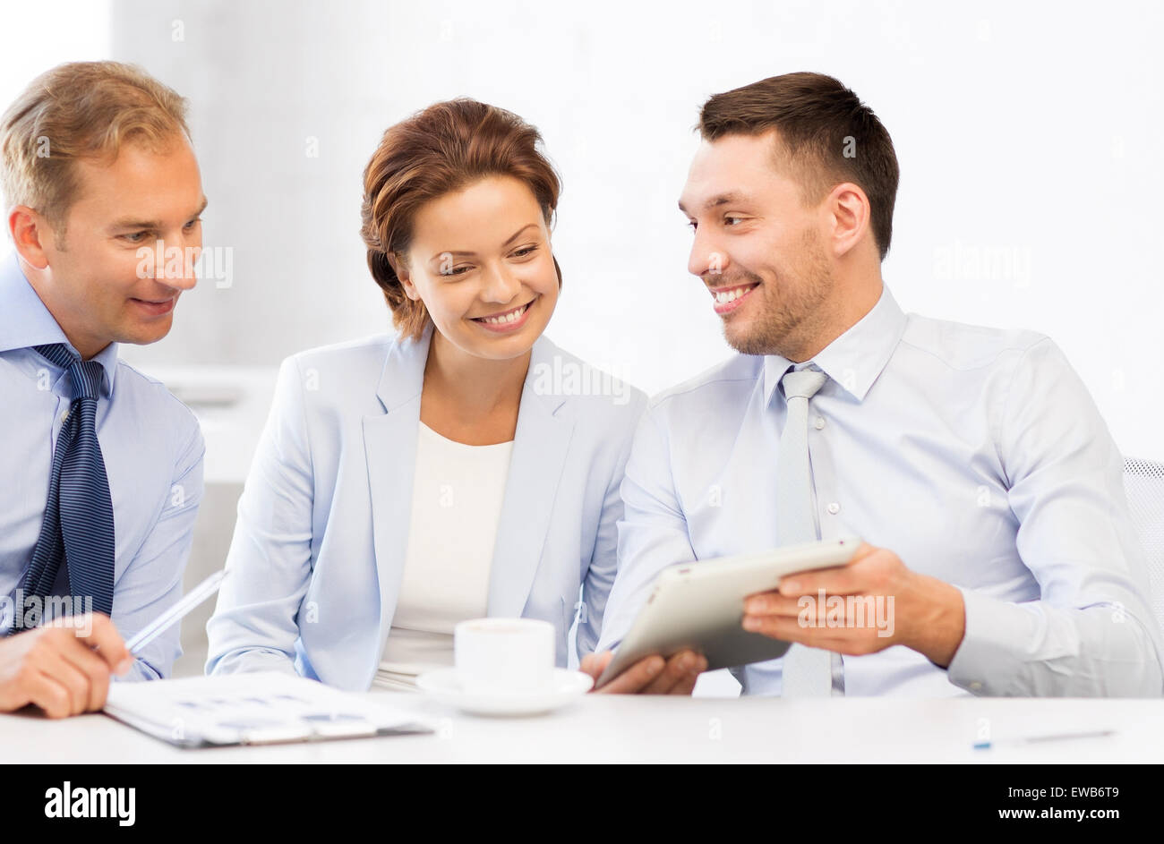 business team having fun with tablet pc in office Stock Photo - Alamy