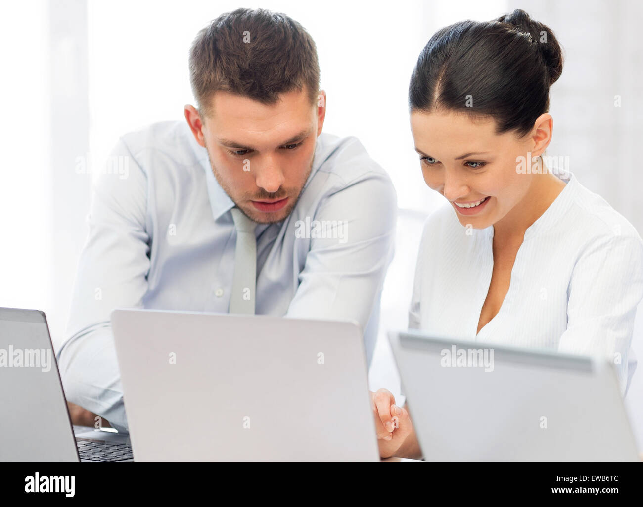 group of people working with laptops in office Stock Photo - Alamy