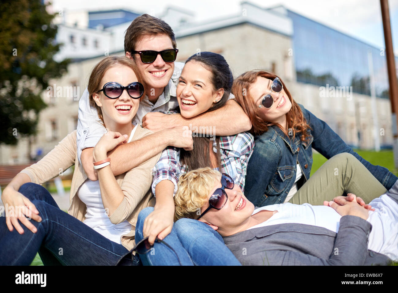group of students or teenagers hanging out Stock Photo - Alamy
