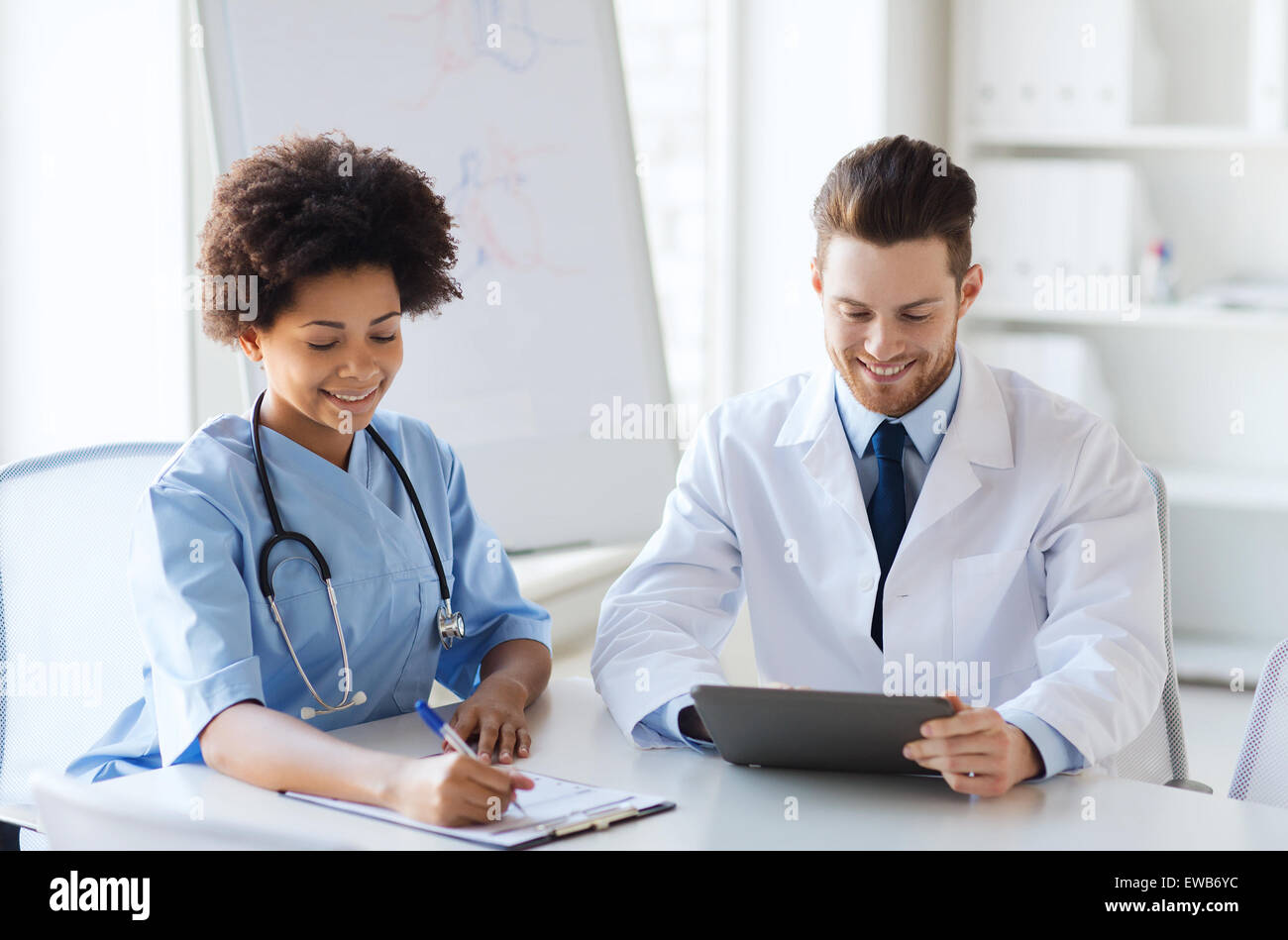 two happy doctors meeting at hospital office Stock Photo - Alamy