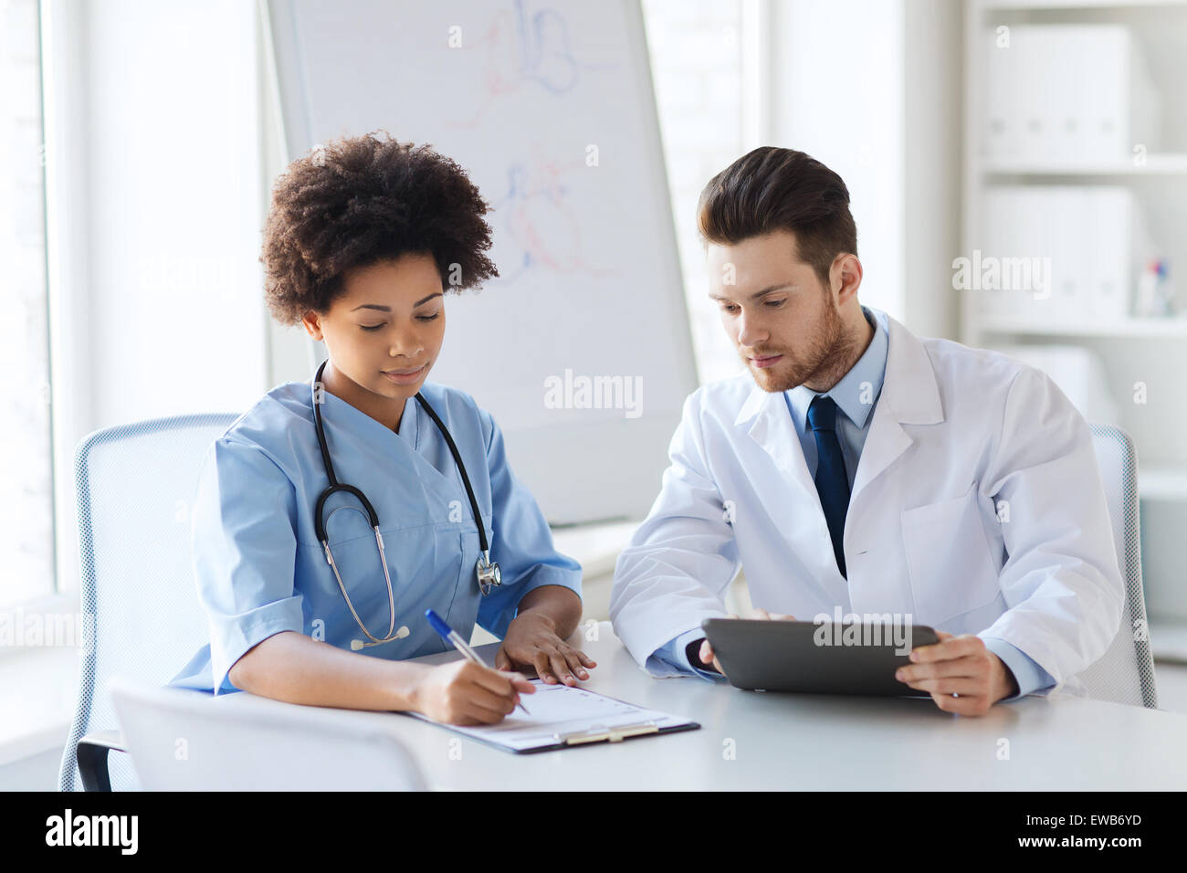 two doctors meeting at hospital office Stock Photo - Alamy