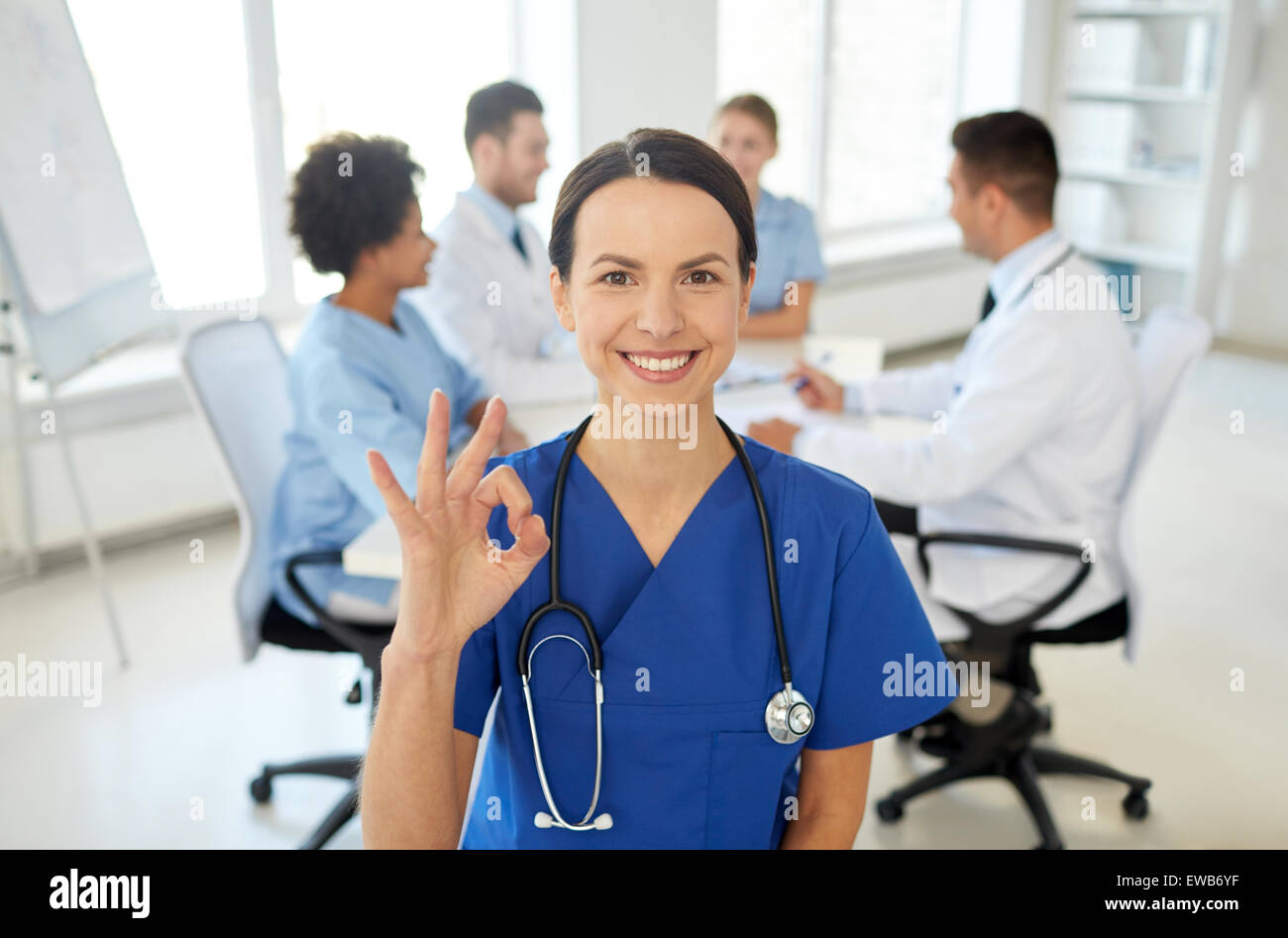 happy doctor over group of medics at hospital Stock Photo - Alamy