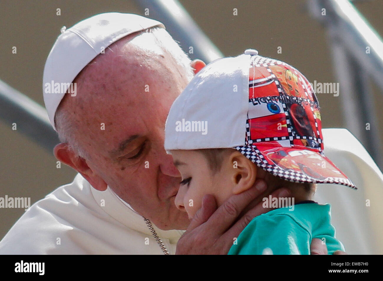 Turin, Italy. 21st June, 2015. Pope Francis kisses a baby during his ...