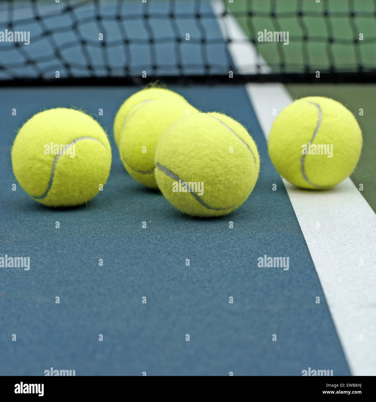 pile of tennis ball on court background Stock Photo - Alamy
