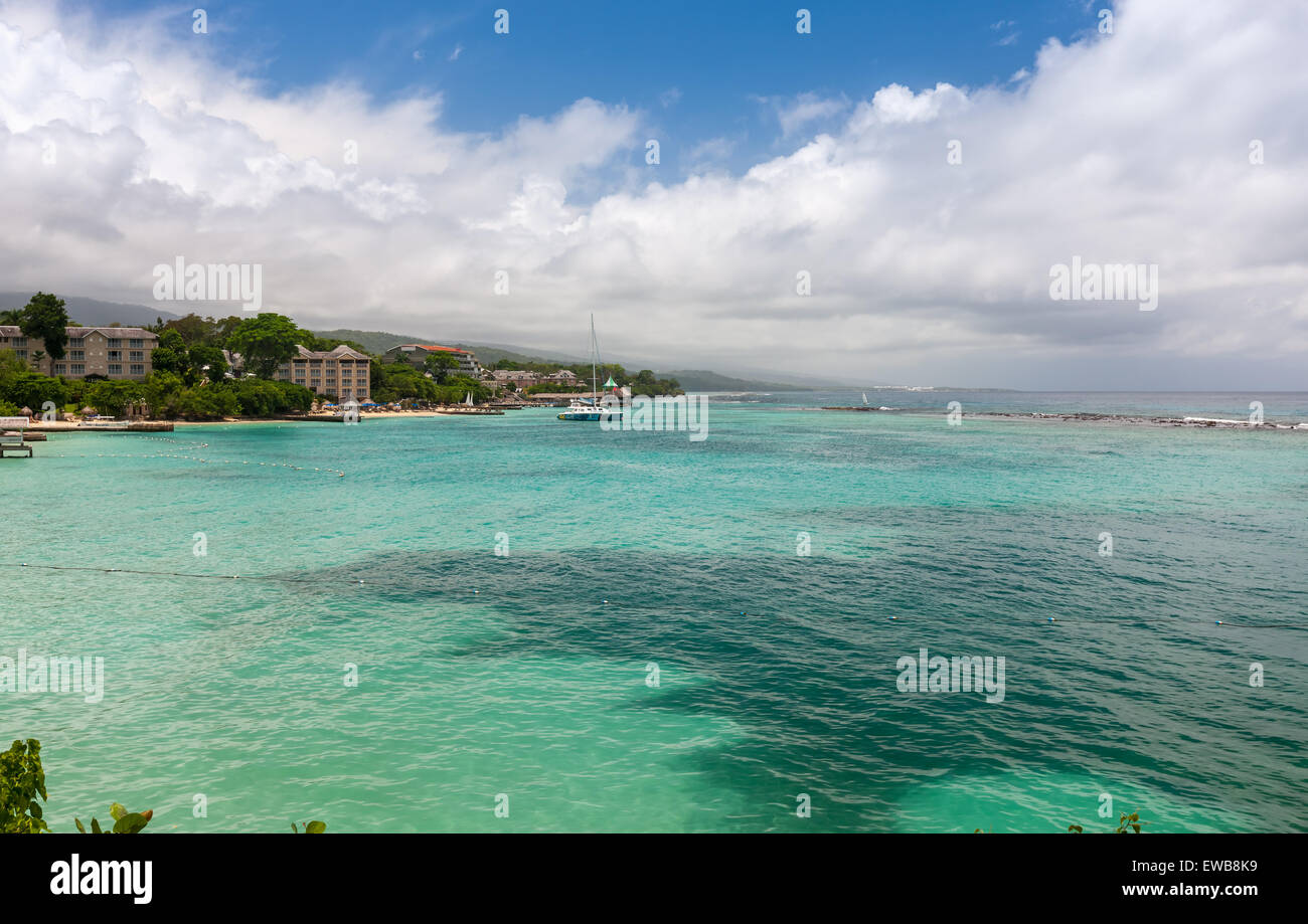 Beach on tropical island. Clear blue water and sky Stock Photo - Alamy