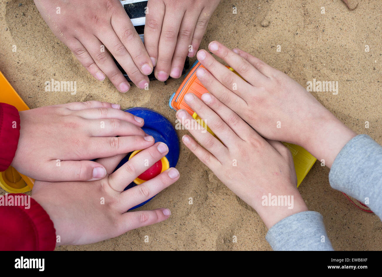 Children hands playing in a sandbox Stock Photo - Alamy