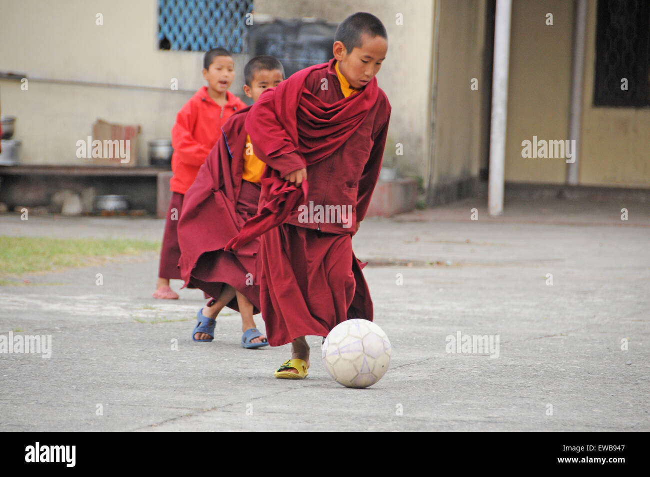 Young monks playing football, Nepal Stock Photo - Alamy