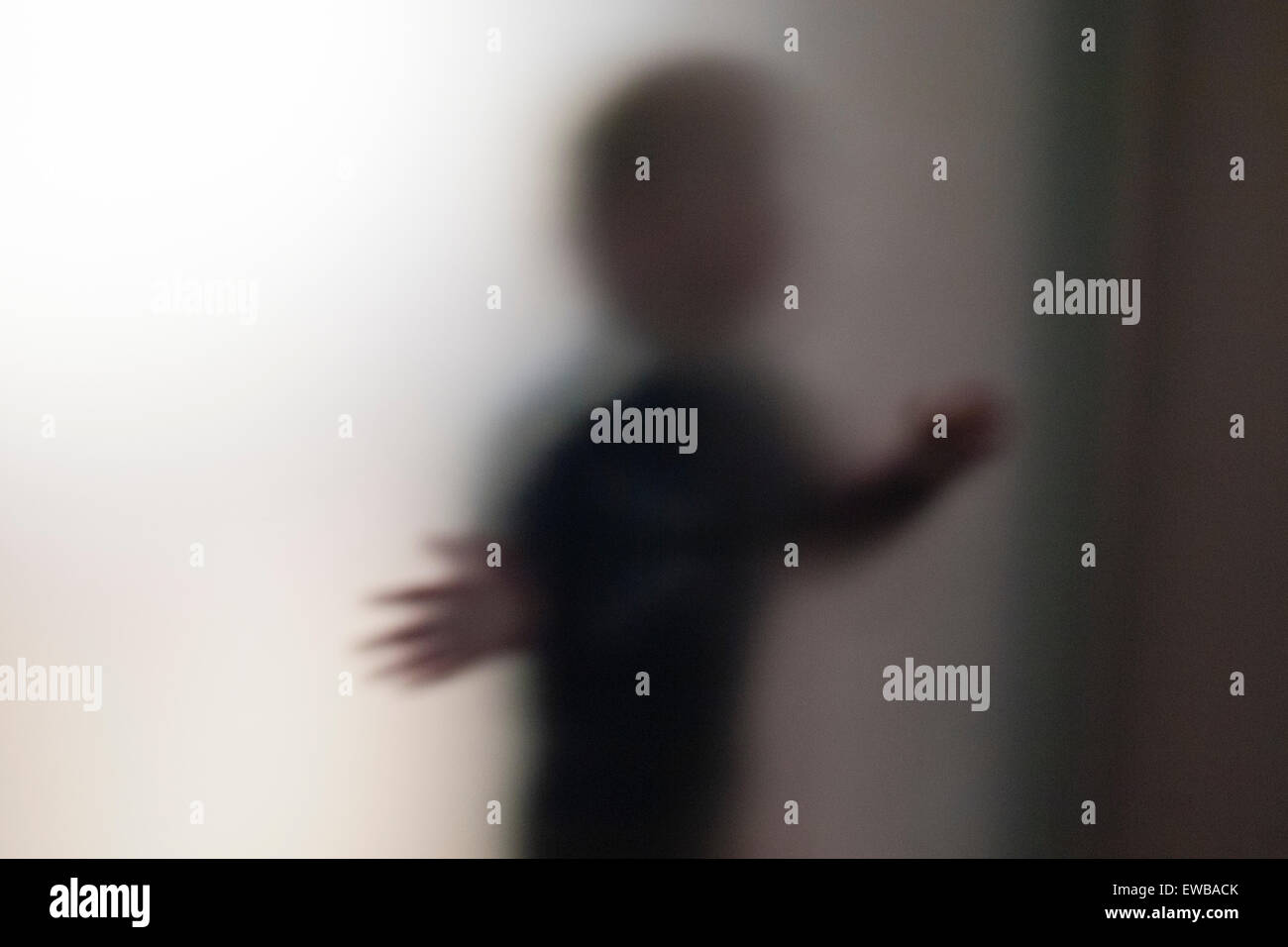 Toddler behind frosted glass Stock Photo - Alamy