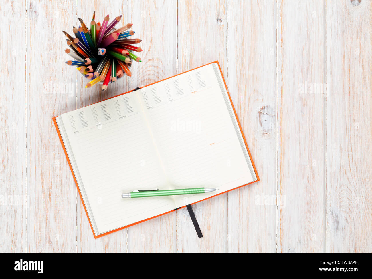 Office desk table with notepad and colorful pencils. Top view Stock ...