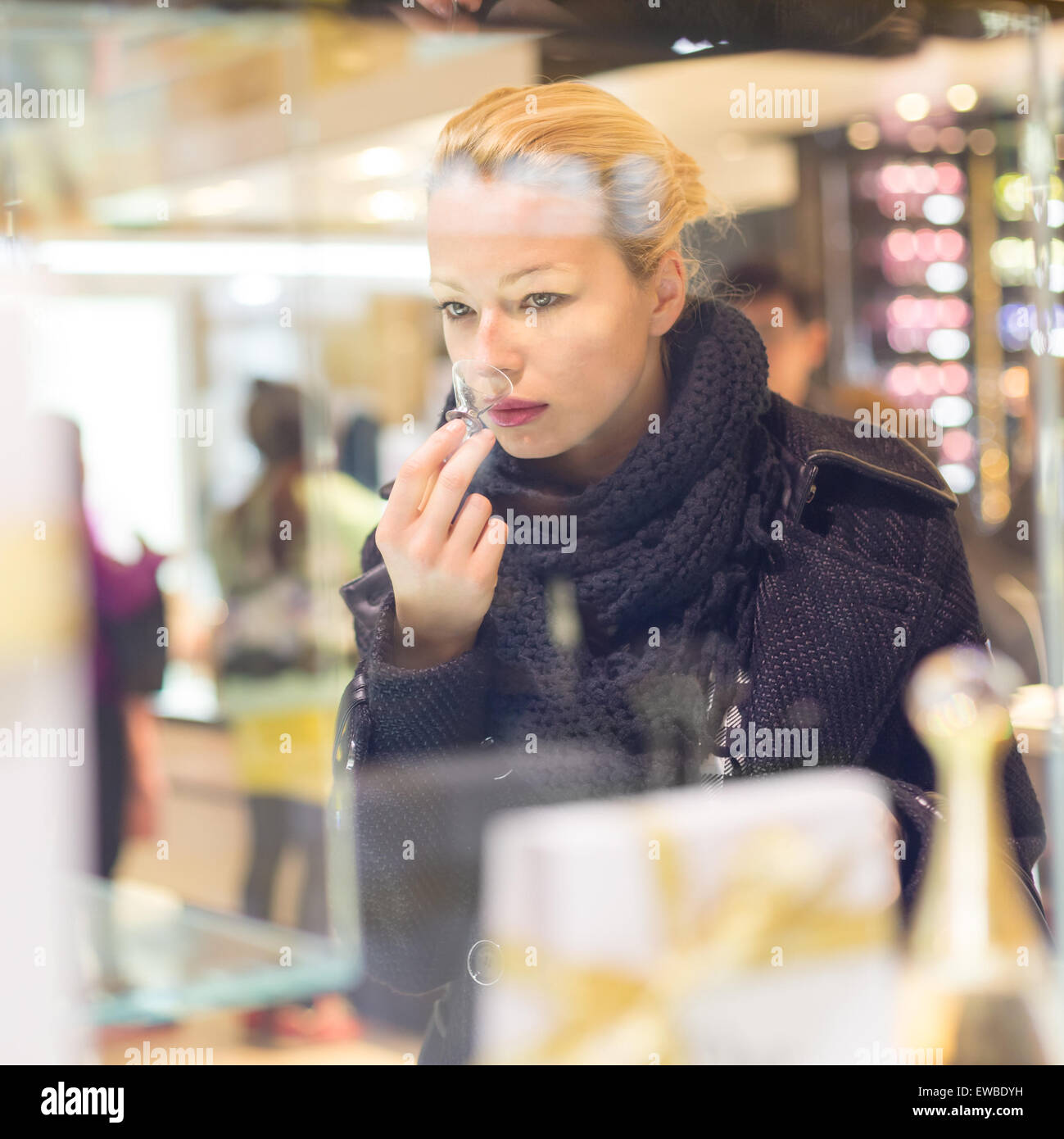 Beautiful woman shopping in beauty store Stock Photo - Alamy