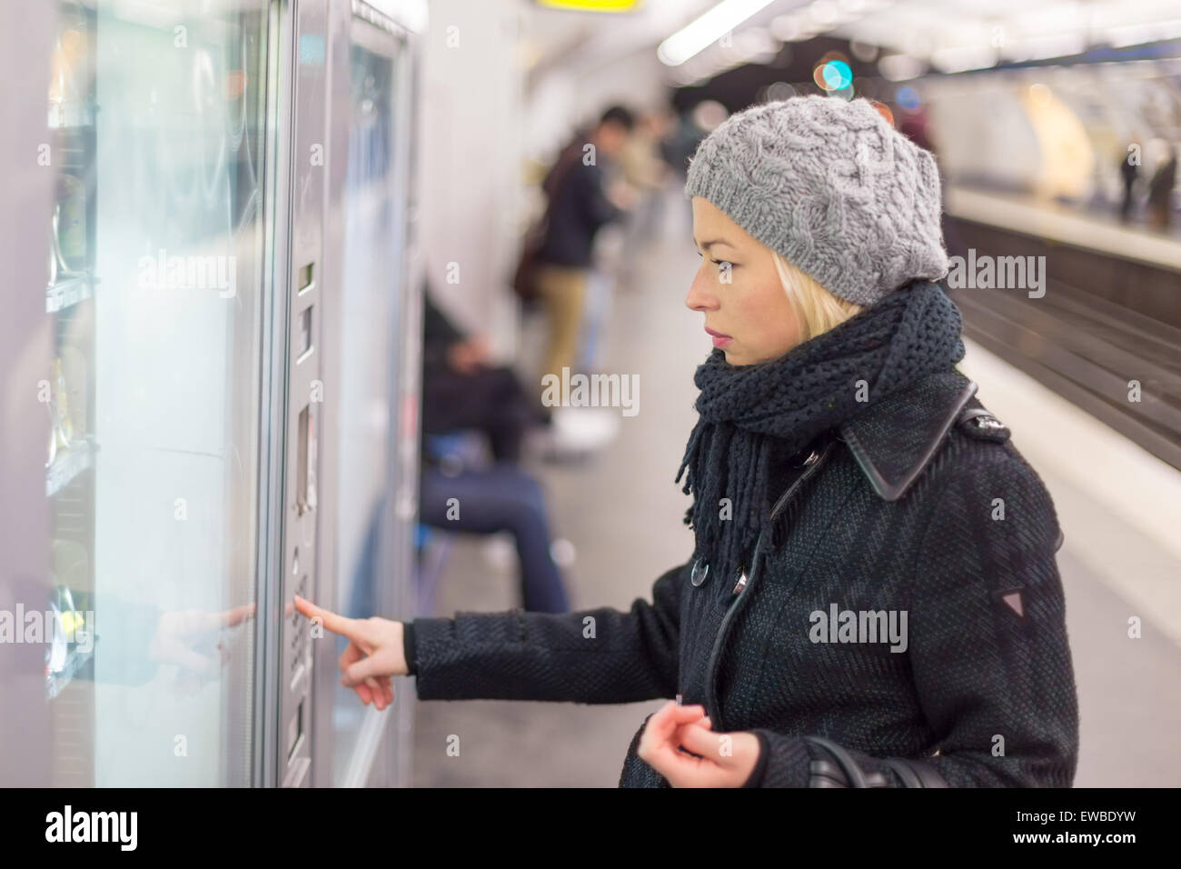 Lady buying ticket for public transport Stock Photo - Alamy