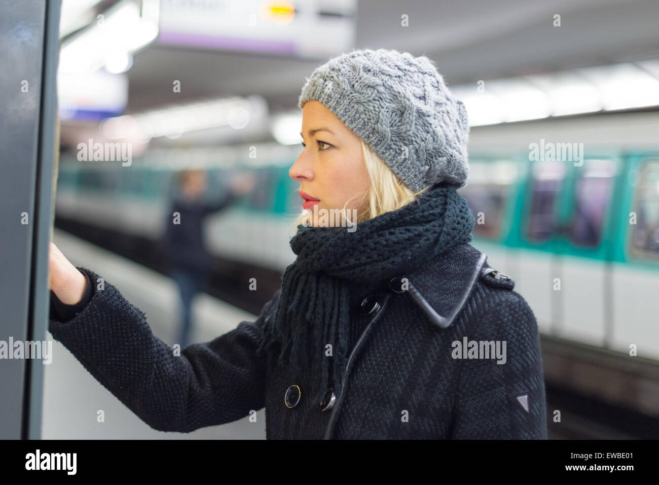 Lady buying ticket for public transport Stock Photo - Alamy
