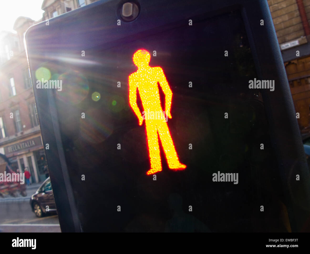 Orange traffic light man, pedestrian crossing Stock Photo - Alamy
