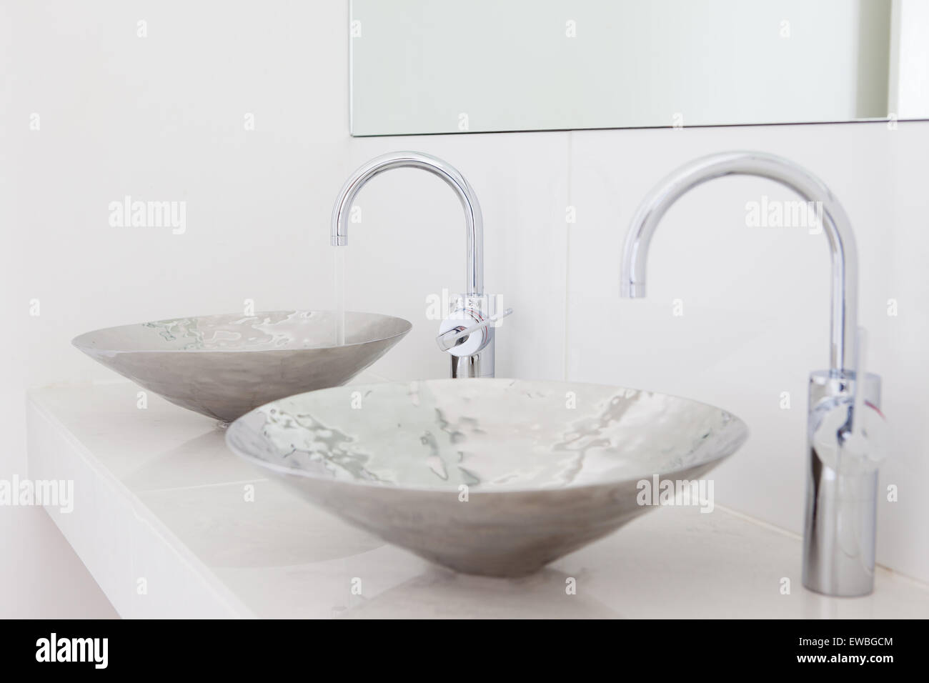 Modern bathroom with 'his and her' double sinks Stock Photo - Alamy