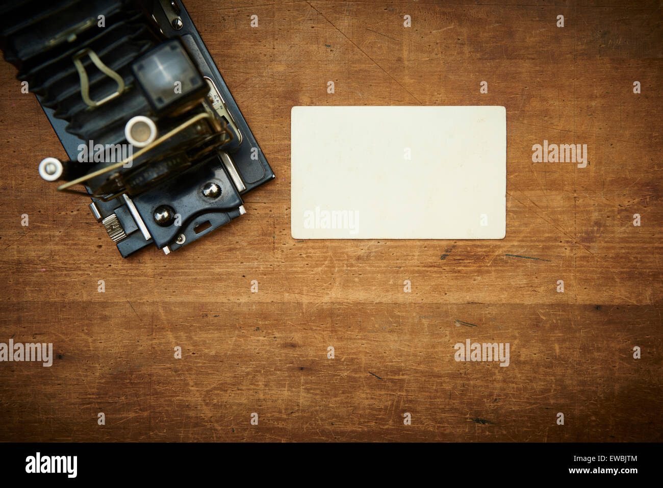 Vintage old retro film camera and old empty paper frame photos on ...