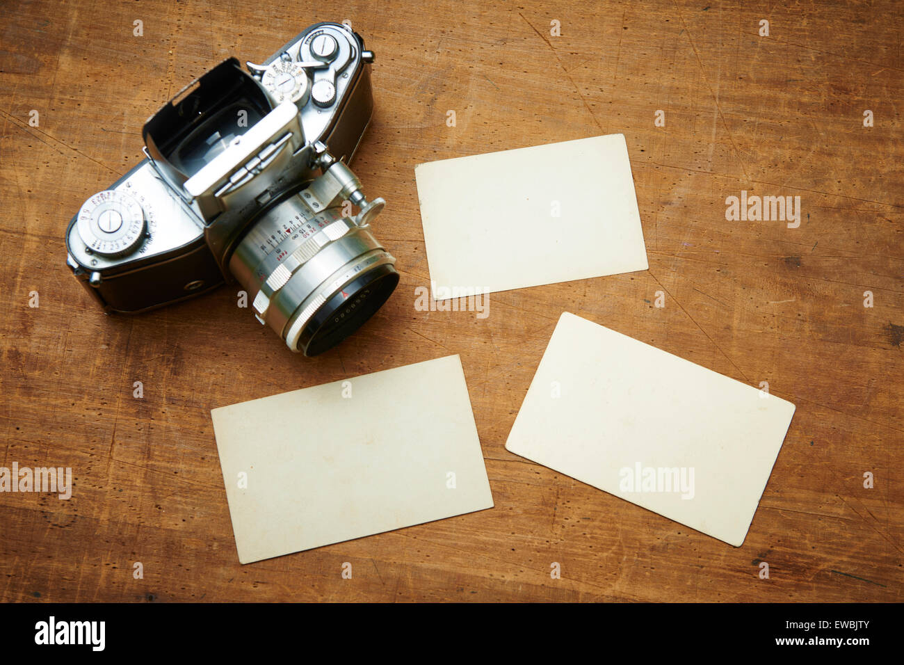 Vintage old retro film camera and old empty paper frame photos on ...