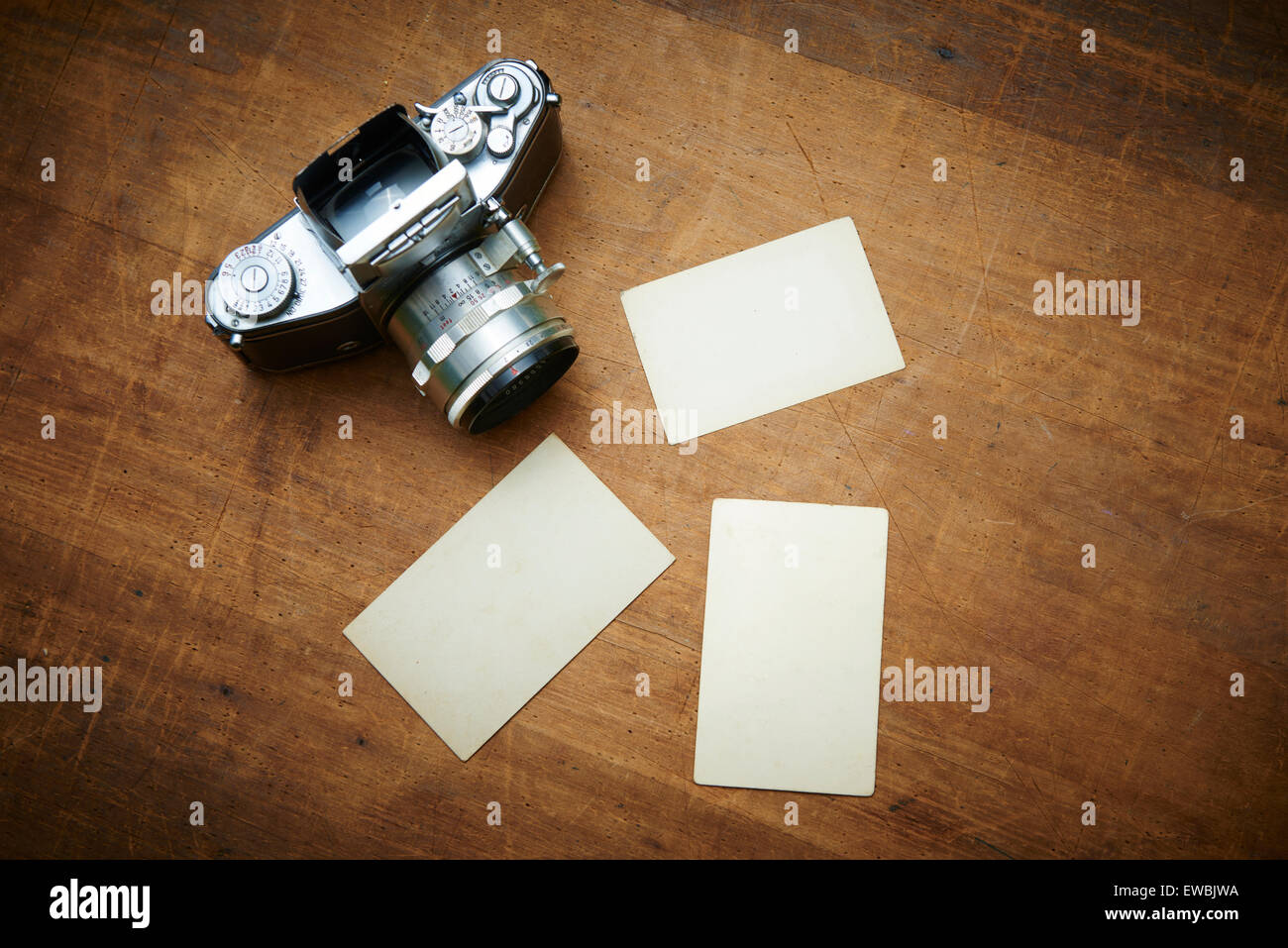 Vintage old retro film camera and old empty paper frame photos on ...