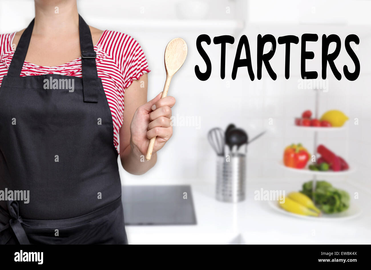 Starters chef holding cooking spoon background Stock Photo - Alamy