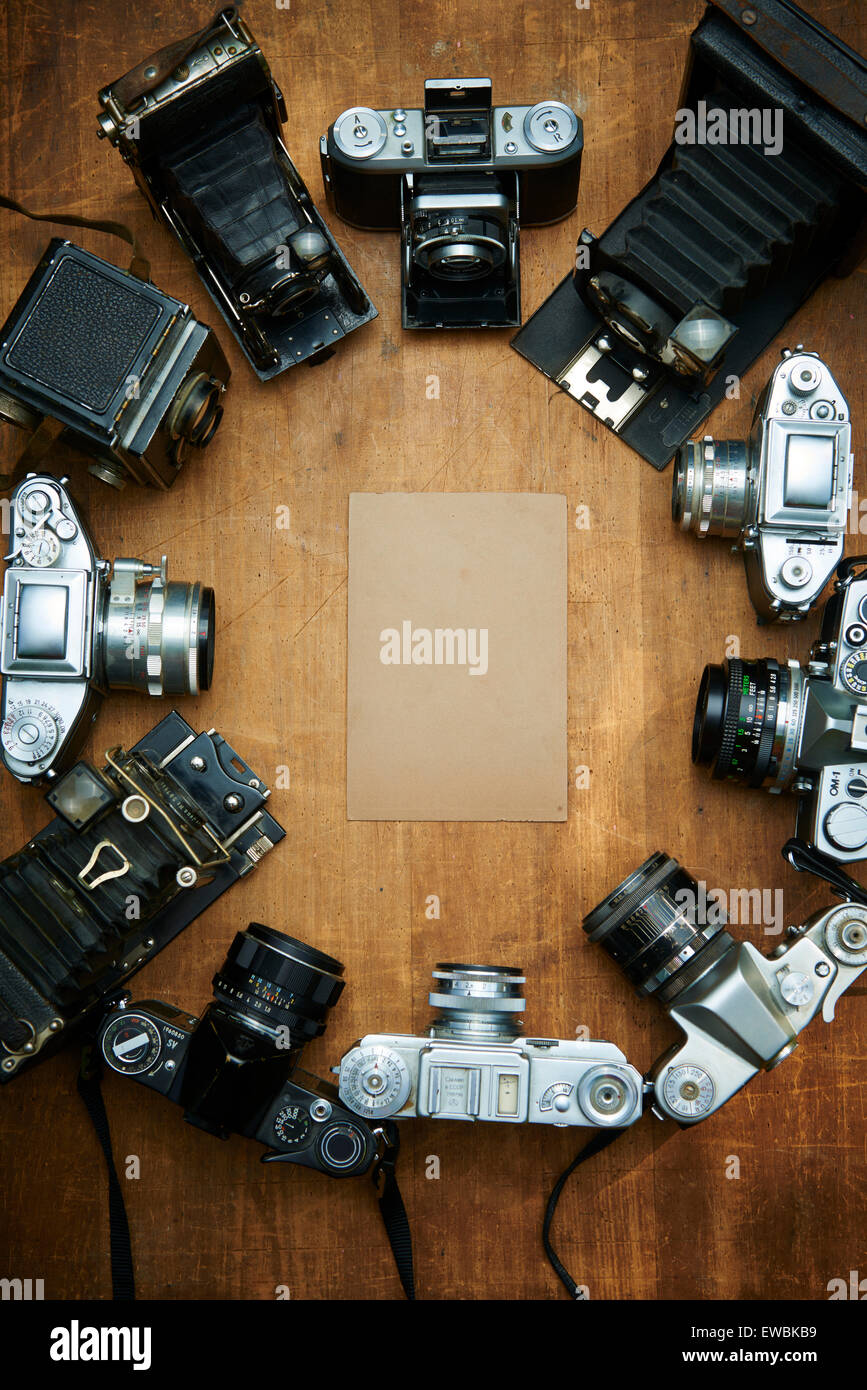 Old retro film analogue cameras collection on vintage wooden desk ...