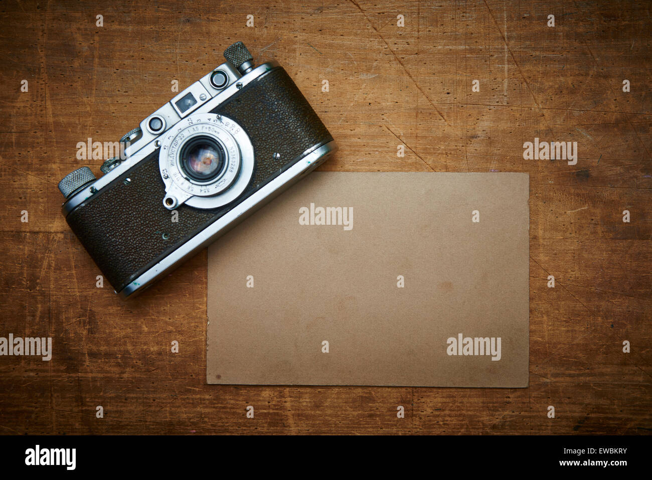 Vintage old retro film camera and old empty paper frame photos on ...