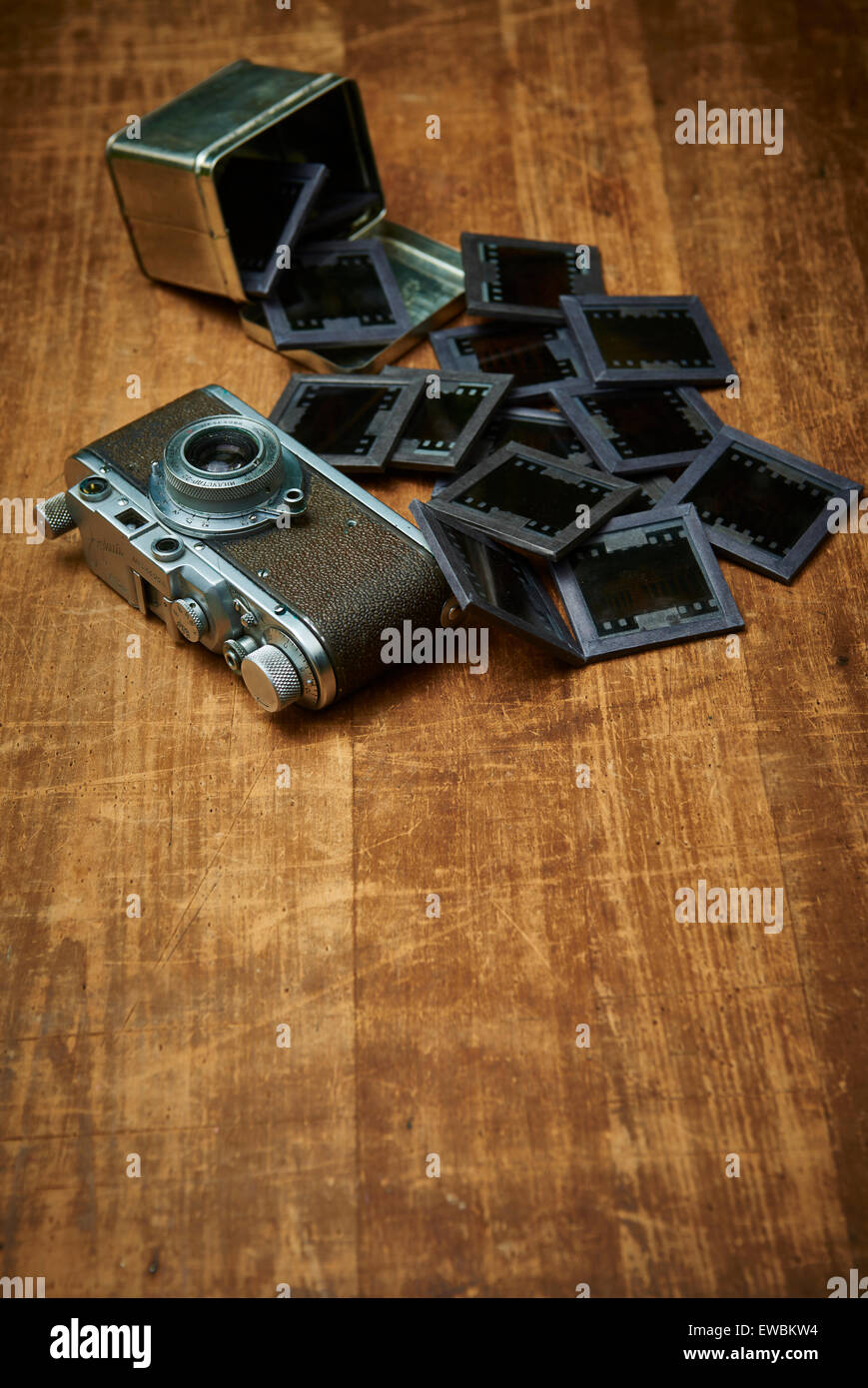 Vintage old retro film camera and old empty paper frame photos on ...