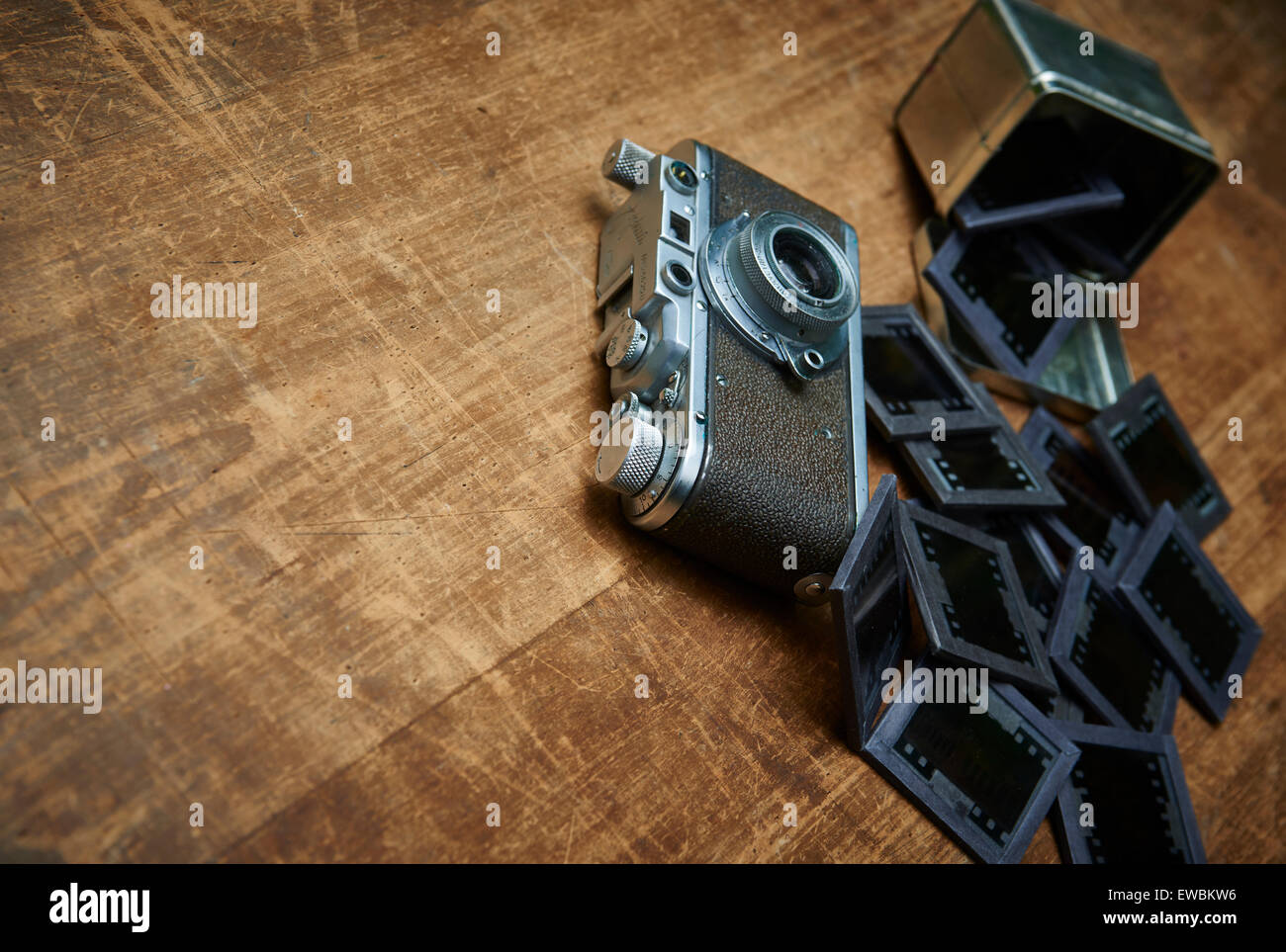 Vintage old retro film camera and old empty paper frame photos on ...