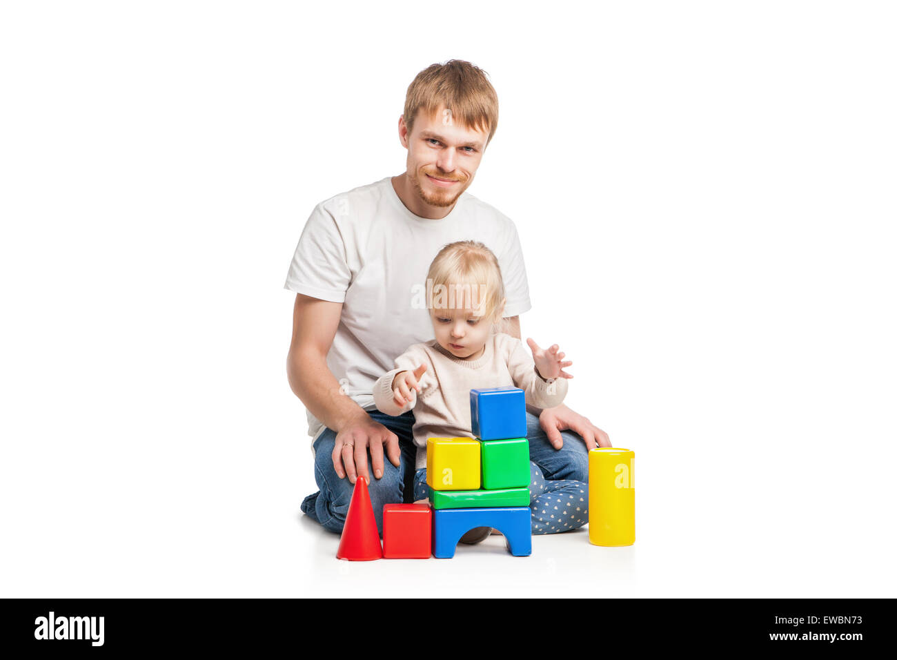 Baby girl building from toy blocks with her father Stock Photo - Alamy