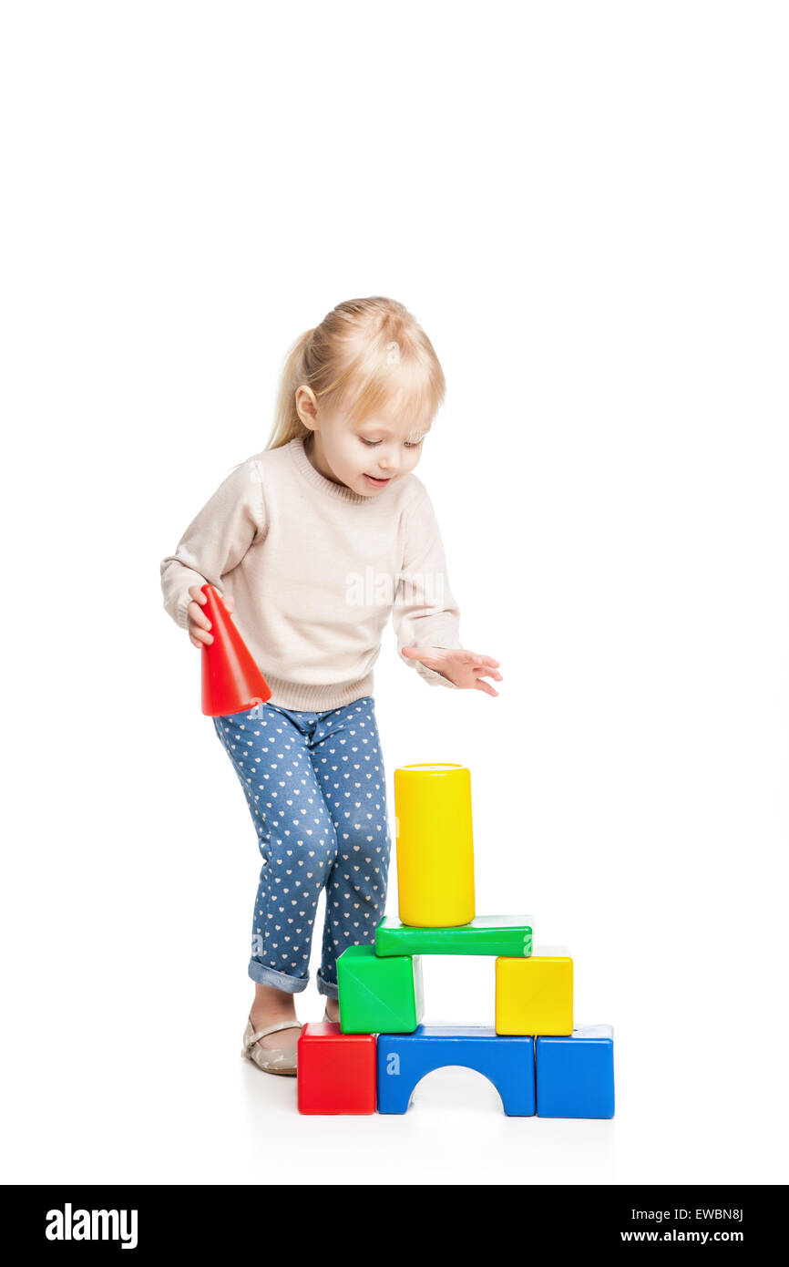 Baby girl building from toy blocks Stock Photo - Alamy