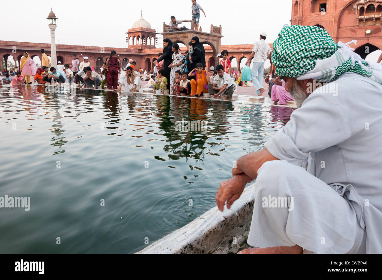 People at the ablution pond in Jama Masjid during Ramadan. Old Delhi ...