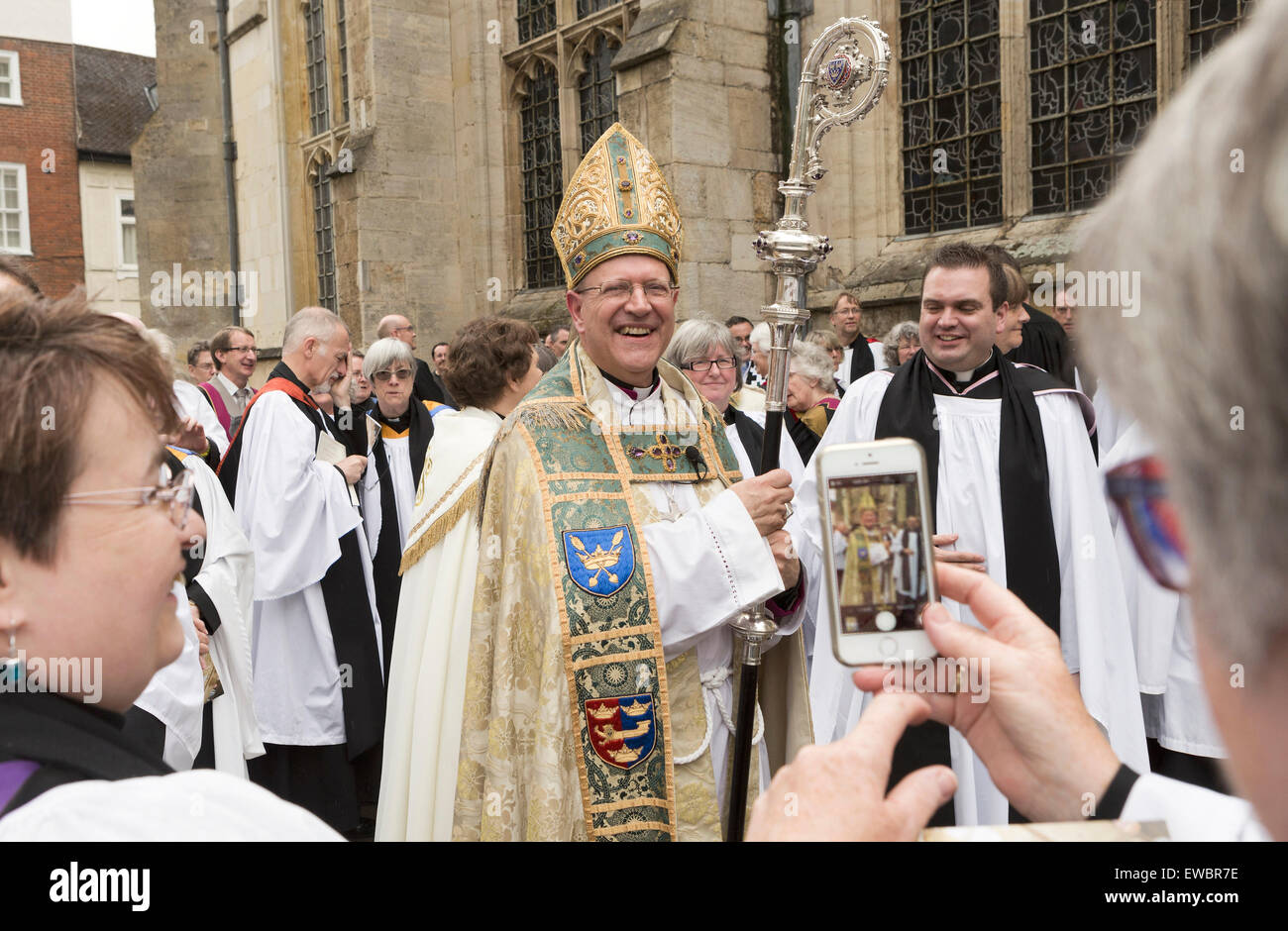 The Right Reverend Martin Seeley; centre, poses for guests after his ...