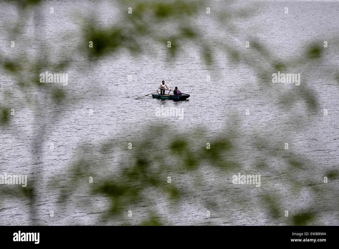 Chongqing, China. 22nd June, 2015. Villagers go fishing on a boat on ...
