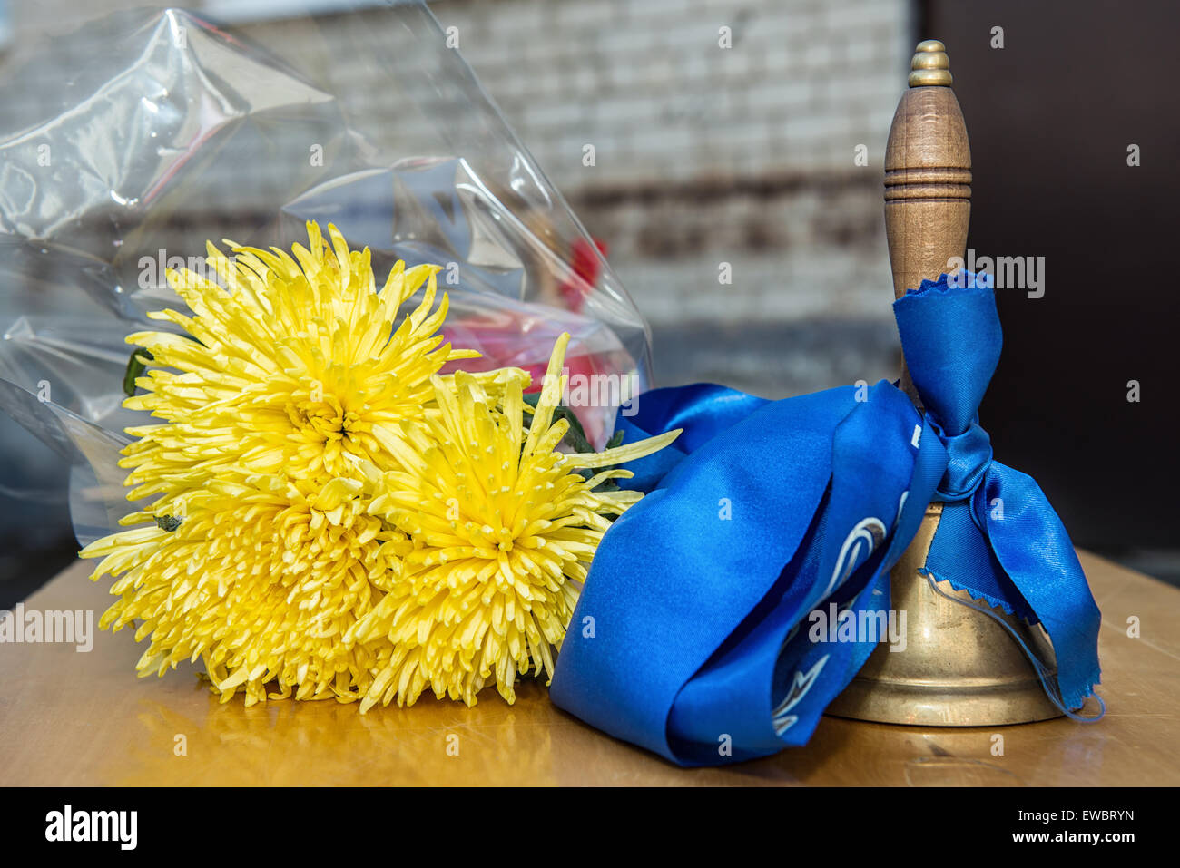 Old school bell with yellow flowers. Last call, graduation Stock Photo ...