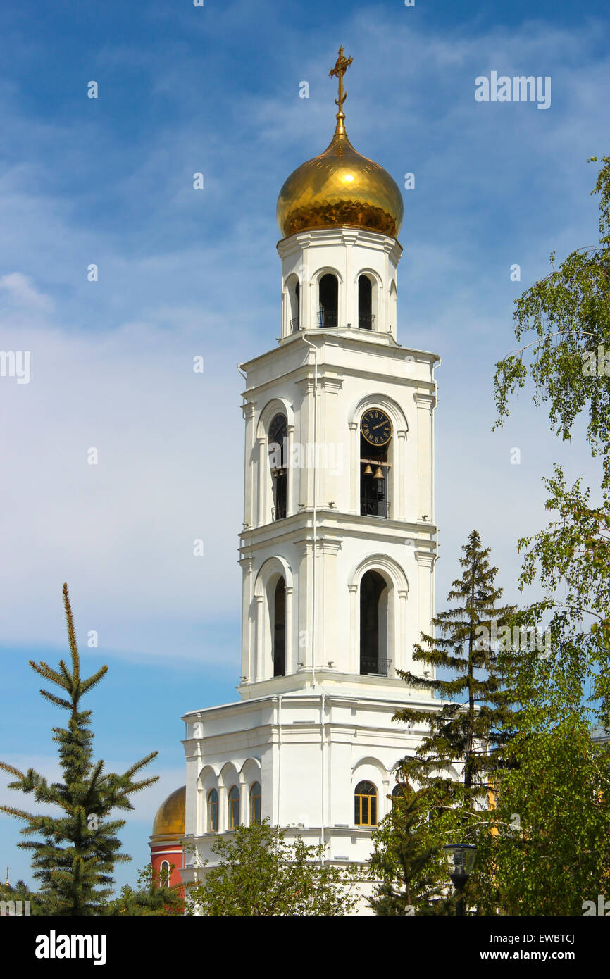 View of the bell tower with a golden dome in Samara on blue sky ...