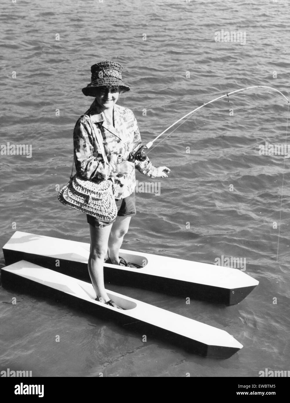 One fishing rod on Black and White Stock Photos & Images - Alamy