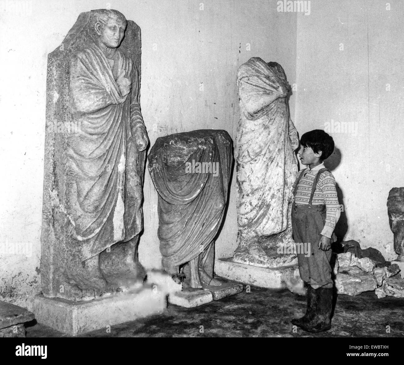 child in front of the Roman statues,fiano romano,1960 Stock Photo - Alamy