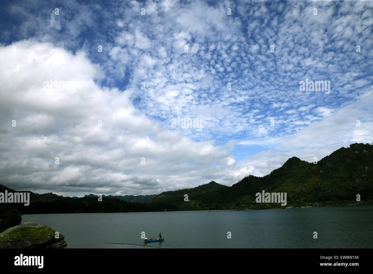 Chongqing, China. 22nd June, 2015. Villagers go fishing on a boat on ...