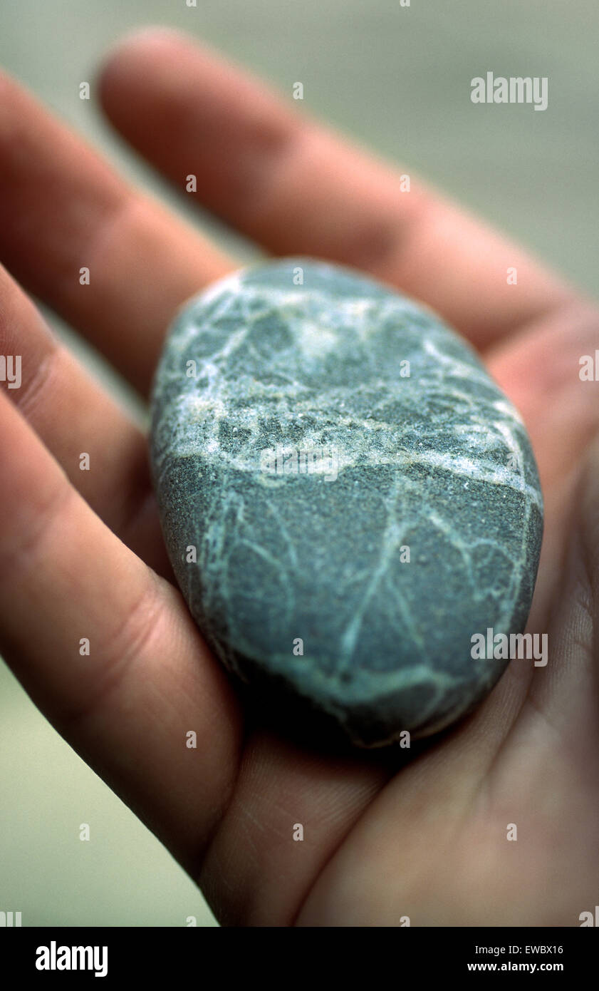 Beautiful stone in hand Stock Photo - Alamy