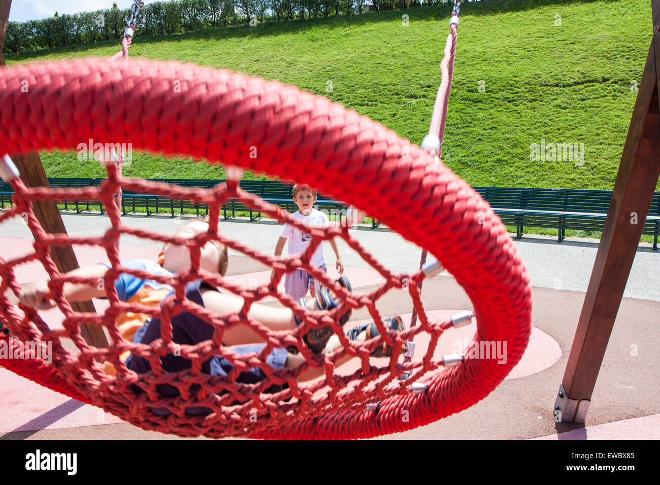 Children swing playground hi-res stock photography and images - Alamy