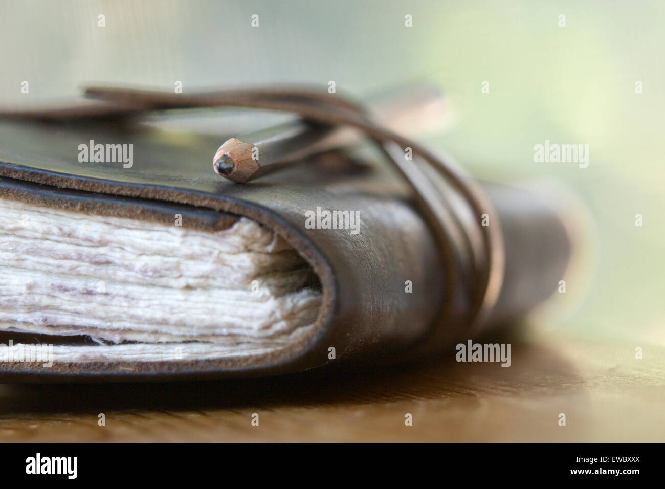 Still life of journal and pencil Stock Photo - Alamy