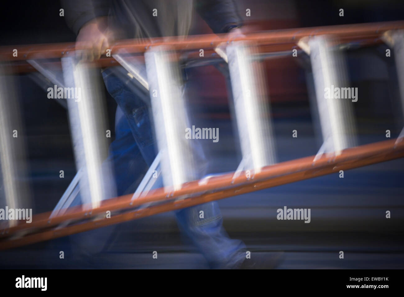 Person carrying a ladder Stock Photo - Alamy