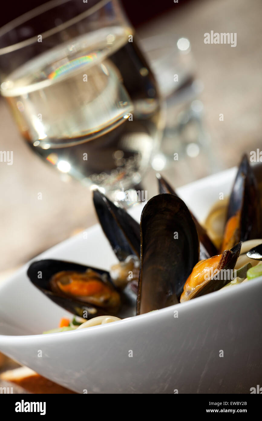 blue mussels and white wine on wood Stock Photo - Alamy